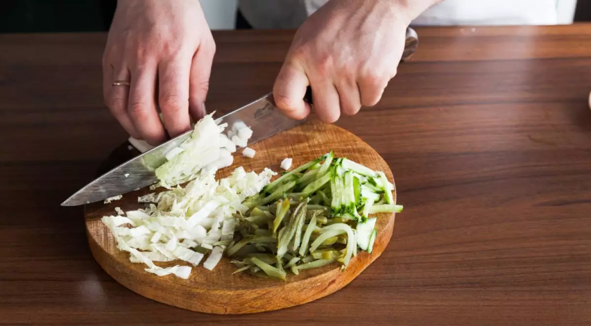 Lenten salad with fish, cut the cabbage and cucumbers