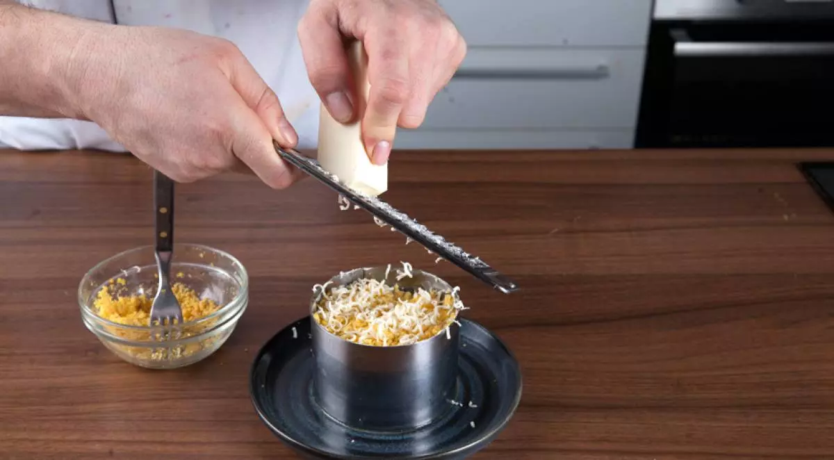 Mimosa salad with rice, soda yolks and butter