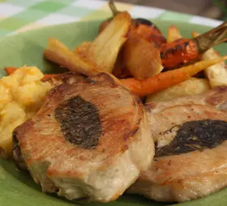 Pork chops with baked vegetables and apple sauce
