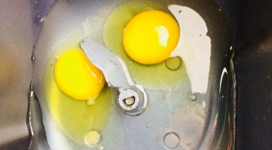 Pour water with eggs to the interconnect bowl of bread maker