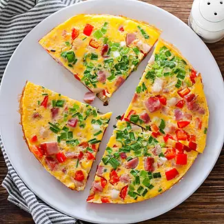 Omelet with ham and vegetables in a slow cooker