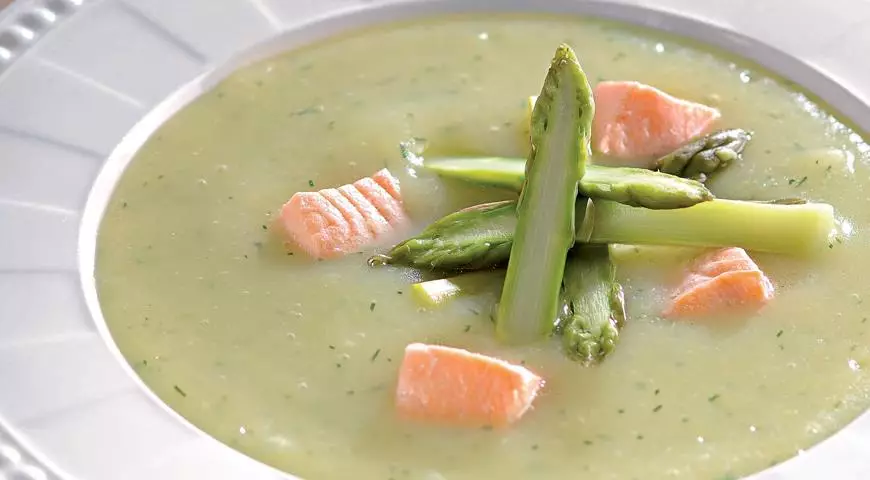 Potato puree soup with asparagus and salmon