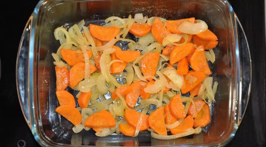 Laying out vegetables in the form for baking