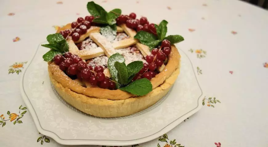 Preparing home pie with dried fruits and lingonberries