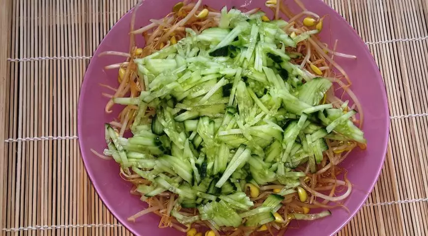 Fresh salad cucumbers cut straw