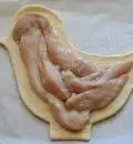 Lay a chicken fillet on the dough