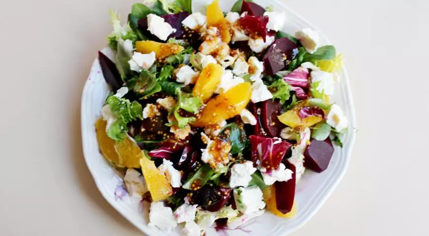 Salad with beet, orange and goat cheese ready for feed