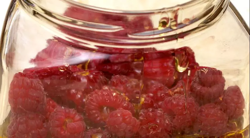 I fall asleep raspberry berries with honey in a jar