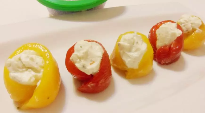 Share rolls of baked pepper on a dish for feeding