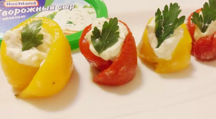 Baked peppers rolls with cottage cheese decorate parsley