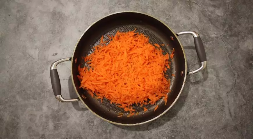 Carrots cut on a large grater and also fry a little