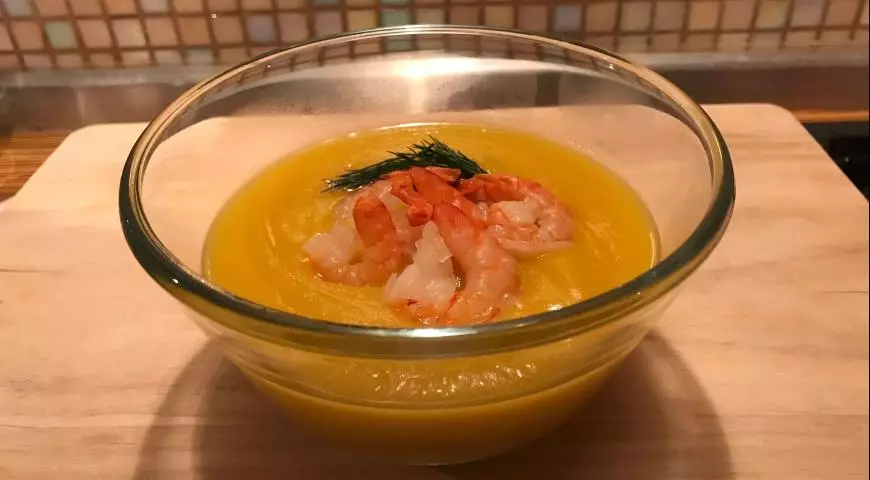 We start cooking pumpkin soup with tiger shrimps