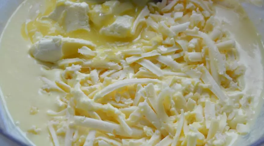 In the cottage cheese mixture, add melted butter and cheese