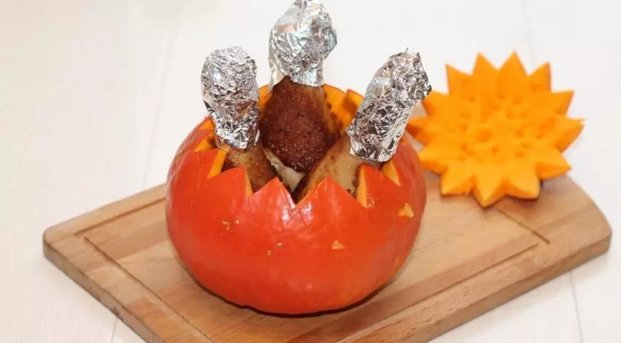 Spicy pumpkin with chicken, shovel in pumpkin