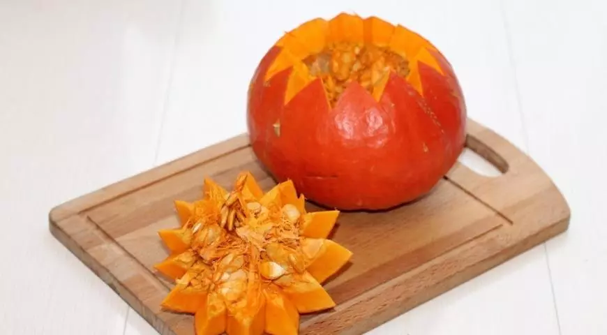 Spicy pumpkin with chicken, cut off pumpkin top