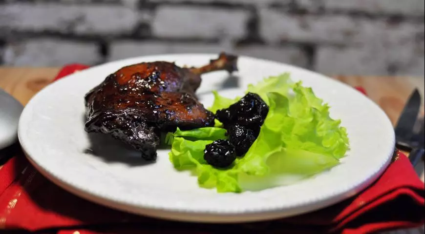 Duck legs in red wine with prunes