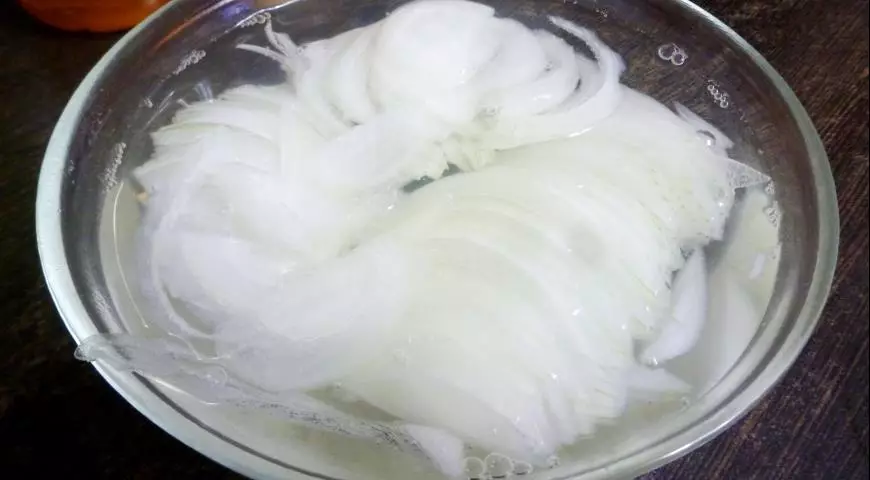 Thin cut onions and pour boiling water
