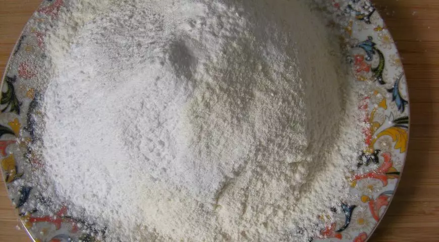 We mix flour for biscuit dough