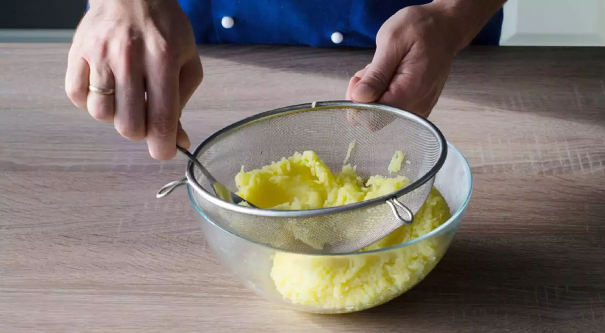 Potato pancakes in a frying pan, wipe potatoes through a sieve