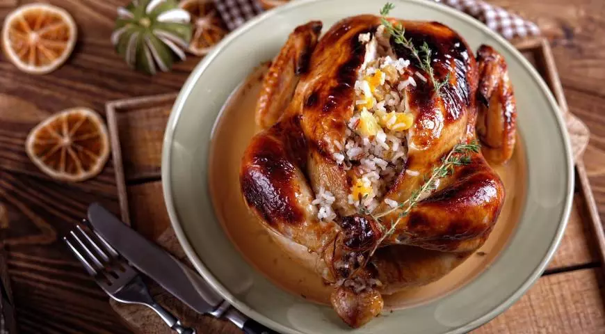 Chicken stuffed with rice and dried fruit baked in orange-honey glaze